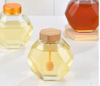 China 300ml Customized Hexagon Glass Honey Jars with Cork Sealing Type and Wooden Dipper for sale
