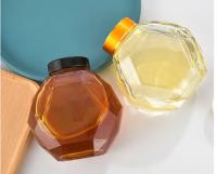China 300ml Customized Hexagon Glass Honey Jars with Cork Sealing Type and Wooden Dipper for sale