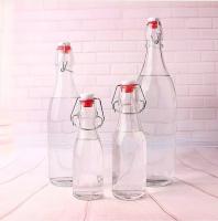 China Glass Bottle Sealing Type Cork 150ml 250ml 500ml 1000ml Round Shape Swing Top Wine Whiskey Bottles for sale