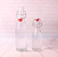 China Glass Bottle Sealing Type Cork 150ml 250ml 500ml 1000ml Round Shape Swing Top Wine Whiskey Bottles for sale