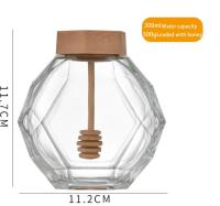 China 300ml Customized Hexagon Glass Honey Jars with Cork Sealing Type and Wooden Dipper for sale