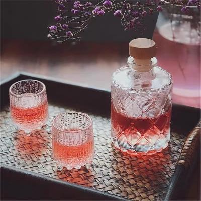 China Round 200 ml 500 ml 700 ml Glass Bottle for Whisky Vodka Wine Carving Cork Juice Milk Tea Drink for sale