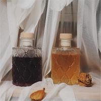 China Round 200 ml 500 ml 700 ml Glass Bottle for Whisky Vodka Wine Carving Cork Juice Milk Tea Drink for sale