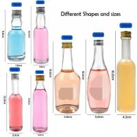 China Body Material Glass 30ml 40ml 50ml 100ml Mini Bottle for Beverage Juice Wine Spirit Liquor for sale