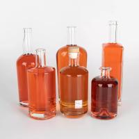 China Custom Color 750ml Transparent Round Wide Mouth Glass Liquor Bottle for Wine Vodka Gin for sale