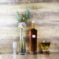 China Capacity 750ml Round Super Flint Glass Vodka Gin Rum Glass Bottle Weight for Whiskey for sale