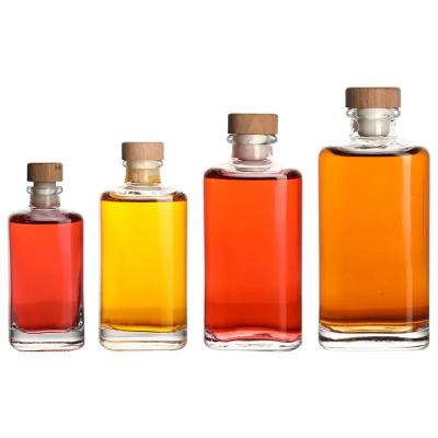 China Round Glass Liquor Wine Whisky Tequila Vodka Bottle with Cork 100ml 200ml 250ml 300ml for sale