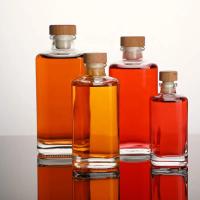 China Round Glass Liquor Wine Whisky Tequila Vodka Bottle with Cork 100ml 200ml 250ml 300ml for sale