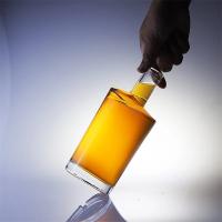 China 750ml Capacity Round Baijiu Bottle with Transparent Glass Material and Wooden Stopper for sale