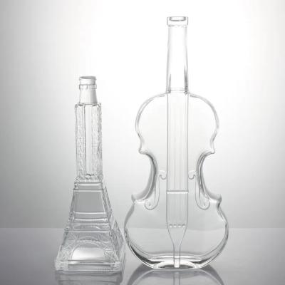 China Surface Handling Decal 500ml 750ml Round Extra Flint Whisky Vodka Brandy Glass Bottle for sale