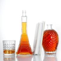 China Surface Handling Decal 500ml 750ml Round Extra Flint Whisky Vodka Brandy Glass Bottle for sale