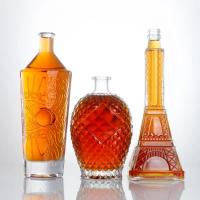 China Surface Handling Decal 500ml 750ml Round Extra Flint Whisky Vodka Brandy Glass Bottle for sale