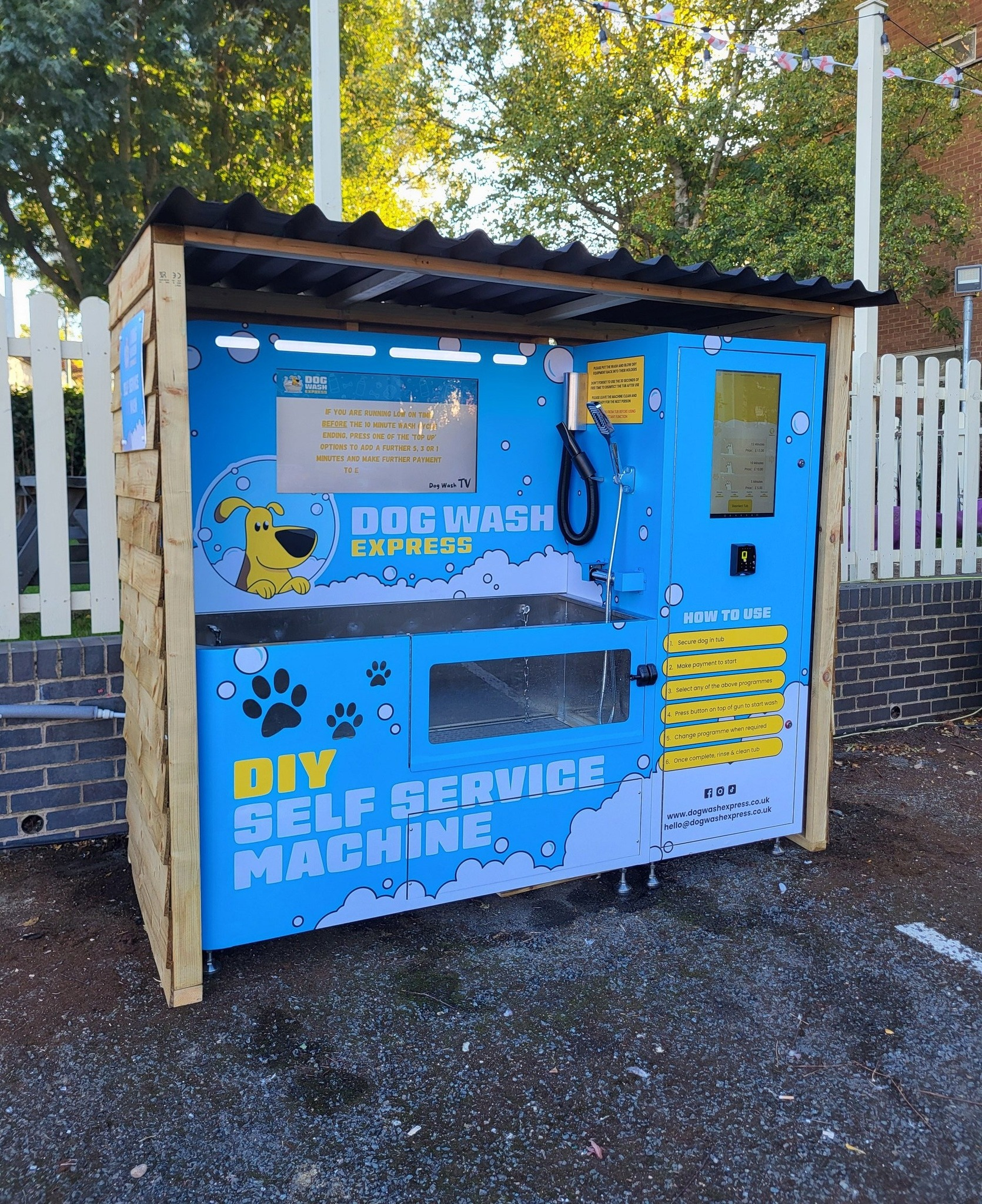 the dog washing machine is place in the park