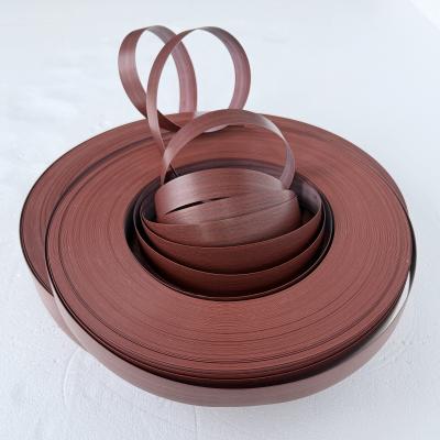China Reddish Brown Mahogany Straight Grain PVC Edge Banding for Panel Furniture for sale