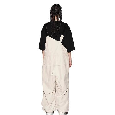 China Winter Ski Jacket with Full Pressure Glue Oblique Collar Solid Color Material Suspender Pants 2 Piece Set for sale
