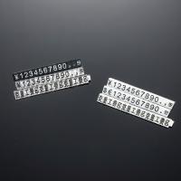 China 140 pcs The 5*3mm price cubes are made from black glossy plastic and have embossed white lettering for sale