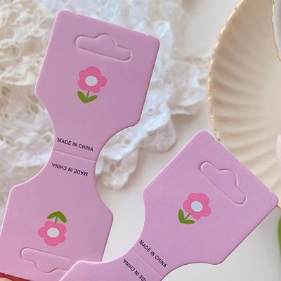 China Embossed Folding Hair Tie Cards Pink Purple Floral 100pcs 9 x 3.5 cm for sale