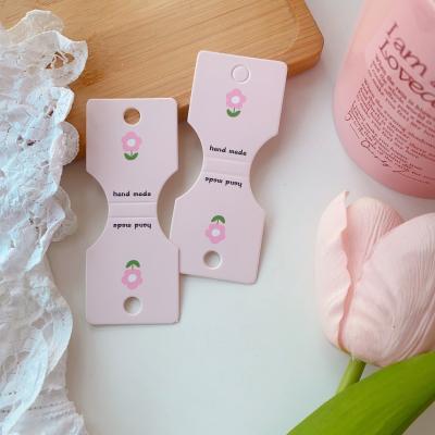China Pink Floral Hair Tie Display Cards Folding 100pcs 9x3.5cm For Retail Display for sale