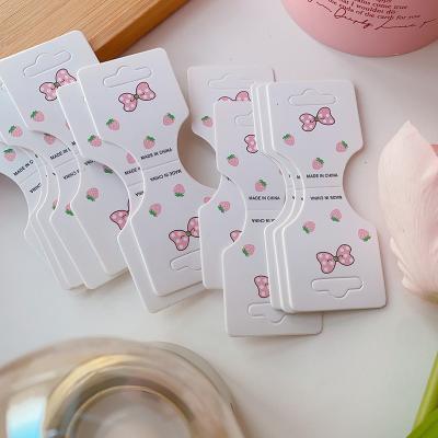 China Strawberry Bow Paperboard Hair Tie Display Cards 100pcs Bulk Pack for sale