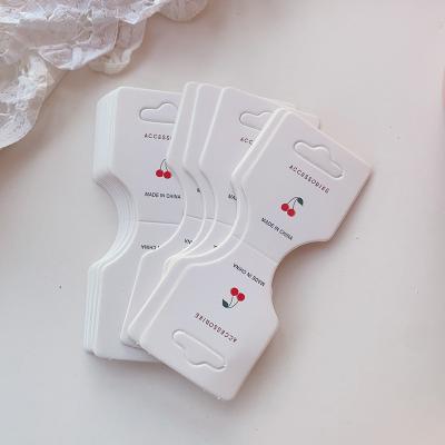 China Paperboard Supermarket Price Tags Cherry Hair Tie Display Cards 100pcs 9 X 3.5 Cm for sale