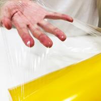 China Transparent Food Plastic Wrap Roll Casting Soft PVC Cling Film Jumbo Roll for sale