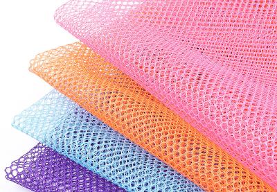 China Warp Knitted Polyester Filament Hexagonal Mesh Fabric Round Hole Mesh for Industrial Use for sale