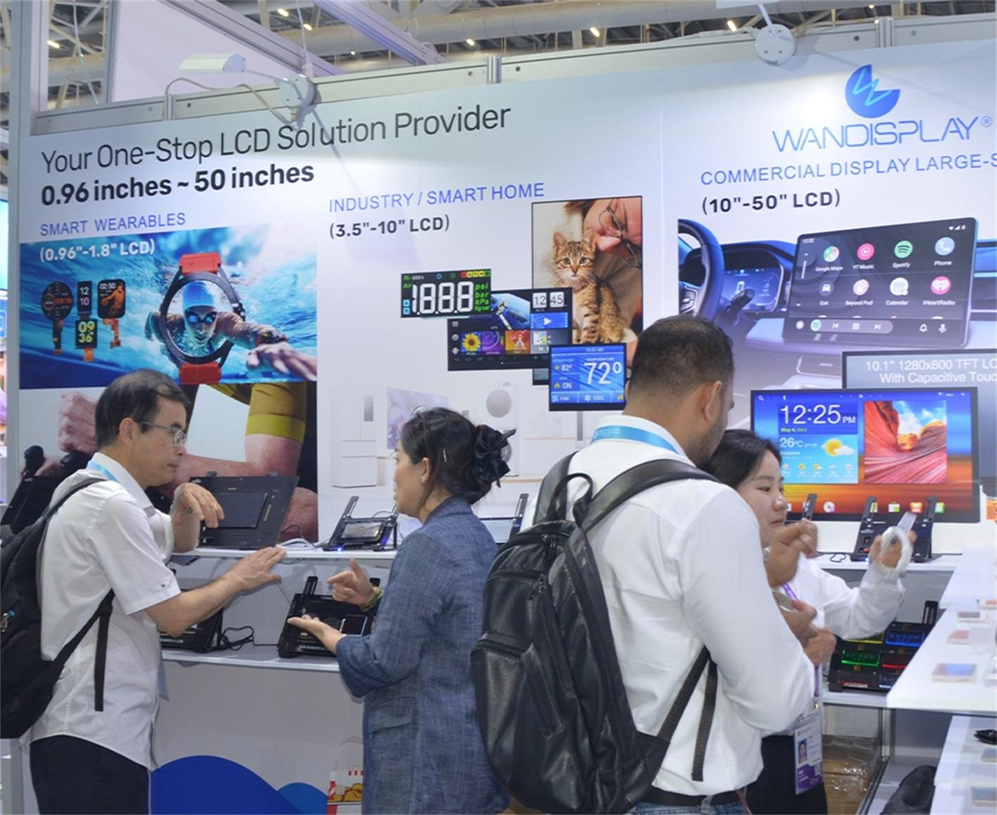 Formike sales team discussing custom LCD display solutions with international buyers at Canton Fair 2026 Booth 20.2 E24.