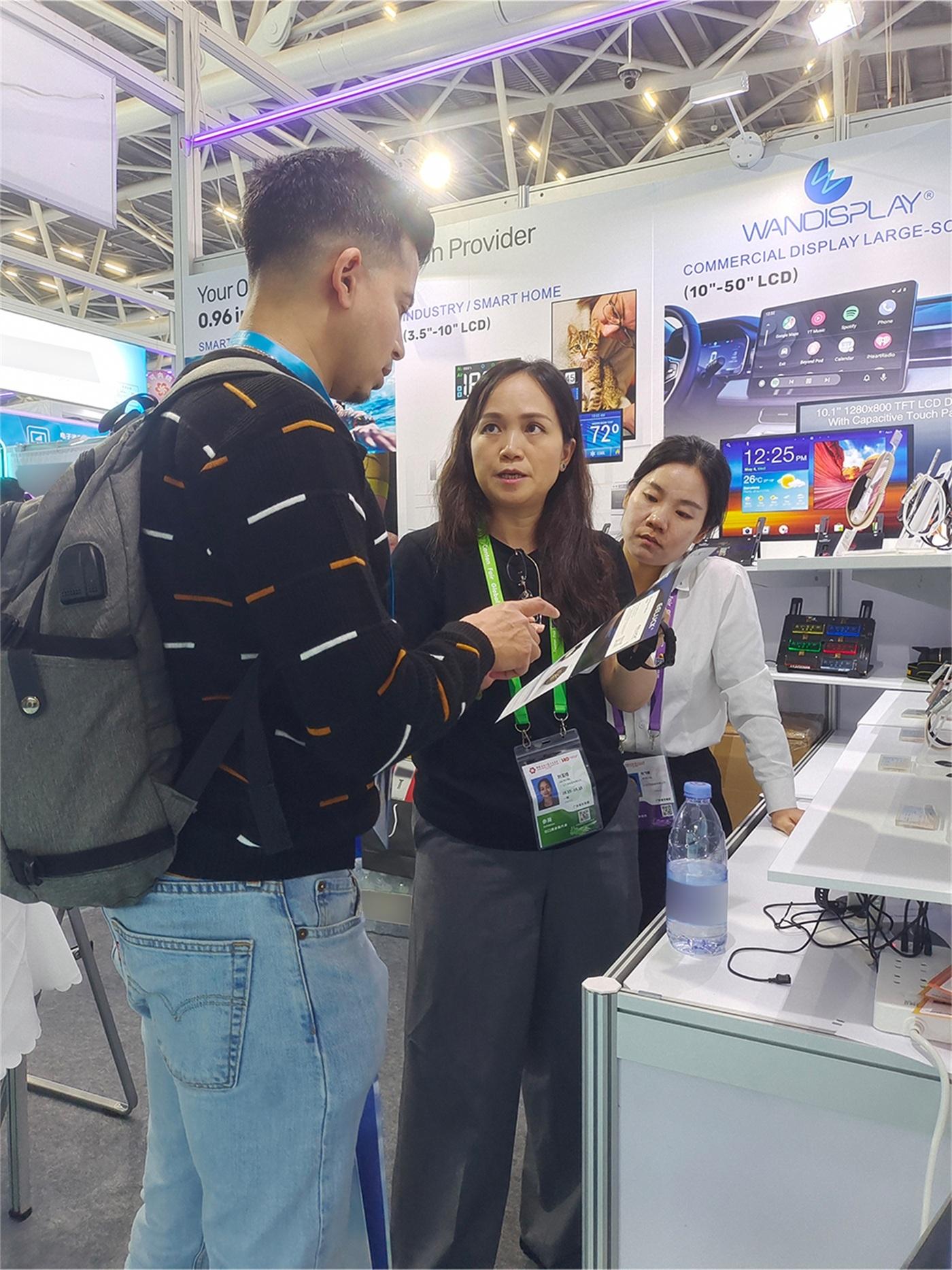 IPS TFT LCD display panel with MIPI and RGB interface options operating at trade show booth.