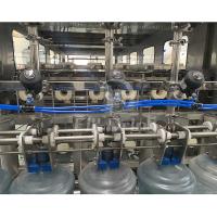 China 1500BPH 2 Decapping Head 5 Gallon Water Filling Machine Rotary Electric Motor Drive for sale