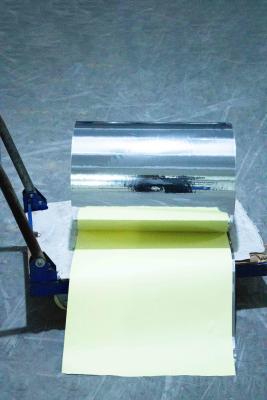 China Self Adhesive Sticker Paper Roll  50 Light silver PET(Coating) acrylic adhesive 140 yellow for sale