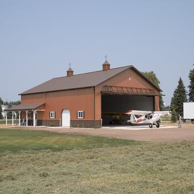 China Prebricated Peb Light Steel Structure Frame Cowshedd Warehouse Workshop Garage Shed Hangar for sale