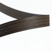 China Dark Walnut Wood Grain PVC Edge Banding Tape with Waterproof Eco Friendly Feature and Custom Thickness 0.4mm~3mm for Furniture for sale