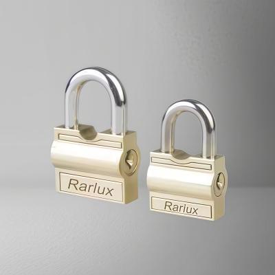 China Rarlux Solid Body Padlock Drum-shaped Side Opening Brass Padlock for sale
