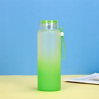 China Sturdy 550ml Glass Water Bottle With Protective Silicone Sleeve Multipurpose Frosted Water Bottle With Bamboo Lid Lightweight  Eco Friendly for sale