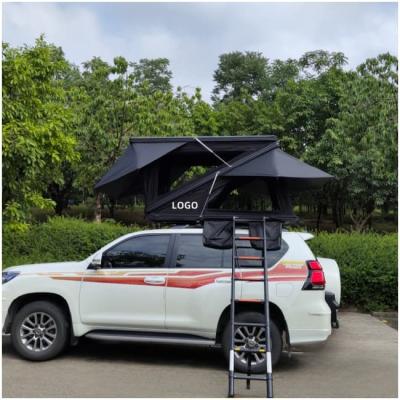 China Black Clamshell Four Person Roof Top Tent With Rain Cover For Outdoor Use for sale