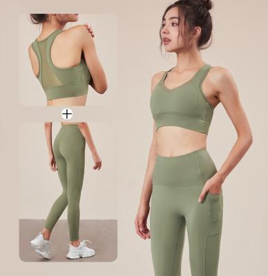 China Sexy Fitness Sportswear Yoga Pants And Sports Bra Set Black Mesh  With Pockets for sale