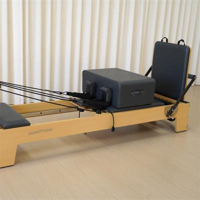 China Commercial Adjustable Multifunctional Pilates Reformer Training Bed Beech Wood for sale