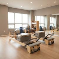 China Professional Wood Pilates Reformer 2250x630x300mm with Spine Corrector and Full Trapeze for Yoga Gym Studio for sale
