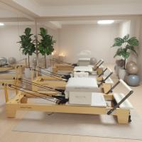 China Durable Beech Wood Pilates Reformer 2250x630x300mm Fitness Training Bed for Studio Home Gym Equipment for sale