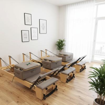 China Adjustable Wooden Pilates Reformer 2250x630x300mm for Fitness Center Custom Logo for sale
