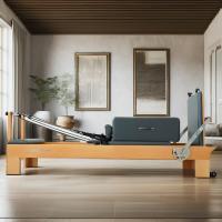 China Custom Eco Friendly Beech Wood Pilates Reformer 2480x680x350mm Yoga Studio Machine for sale