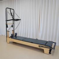 China Custom Wood Pilates Reformer With Tower For Studio Core Bed With Half Trapeze for sale