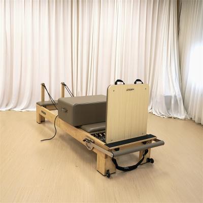 China Maple Wood Pilates Reformer 2480x680x350mm Portable Plate Shaper Cushioned Yoga Machine for sale