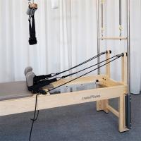 China Multifunctional Cadillac Reformer Machine Elevated Wood Bed Combo With Trapeze For Pilates for sale