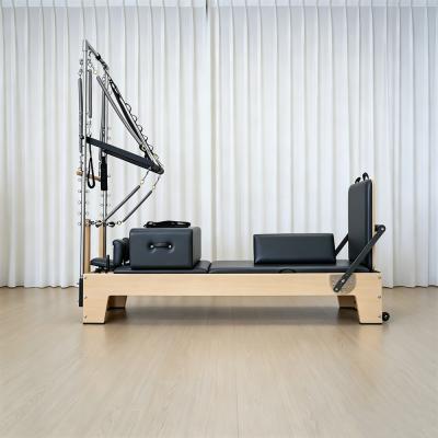 China Direct Factory Multi-layer Solid Wood Pilates Reformer With Half Tower Customizable Frame Surface Leather Logo Complete Matching Accessories for sale
