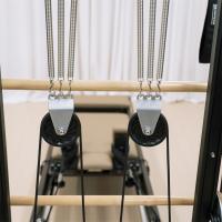China Solid Wood Pilates Reformer with Spiral Half Trapeze Tower 304 Stainless Steel Custom Frame Color Leather Logo for sale