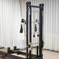 China Solid Wood Pilates Reformer with Spiral Half Trapeze Tower 304 Stainless Steel Hardware Custom Frame Color for sale