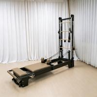China Solid Wood Pilates Reformer with Spiral Half Trapeze Tower 304 Stainless Steel Custom Logo OEM for sale