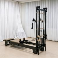 China Solid Wood Pilates Reformer with Spiral Half Trapeze Tower 304 Stainless Steel Custom Frame Color Leather Logo for sale