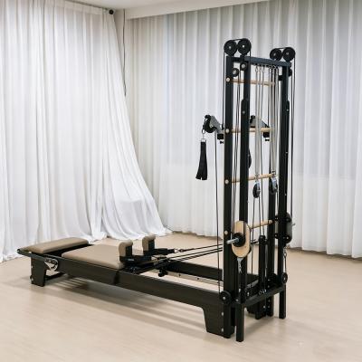 China Solid Wood Pilates Reformer with Spiral Half Trapeze Tower 304 Stainless Steel Custom Frame Color Leather Logo for sale